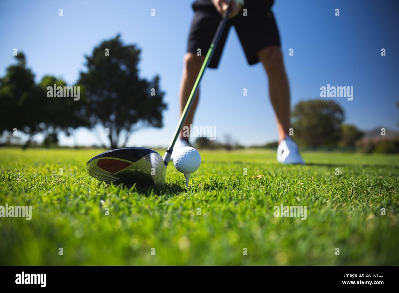 Golfer playing golf Stock Photo - Alamy