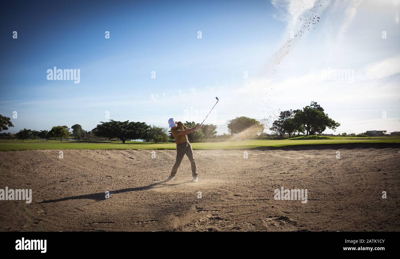 Golfer playing golf Stock Photo - Alamy