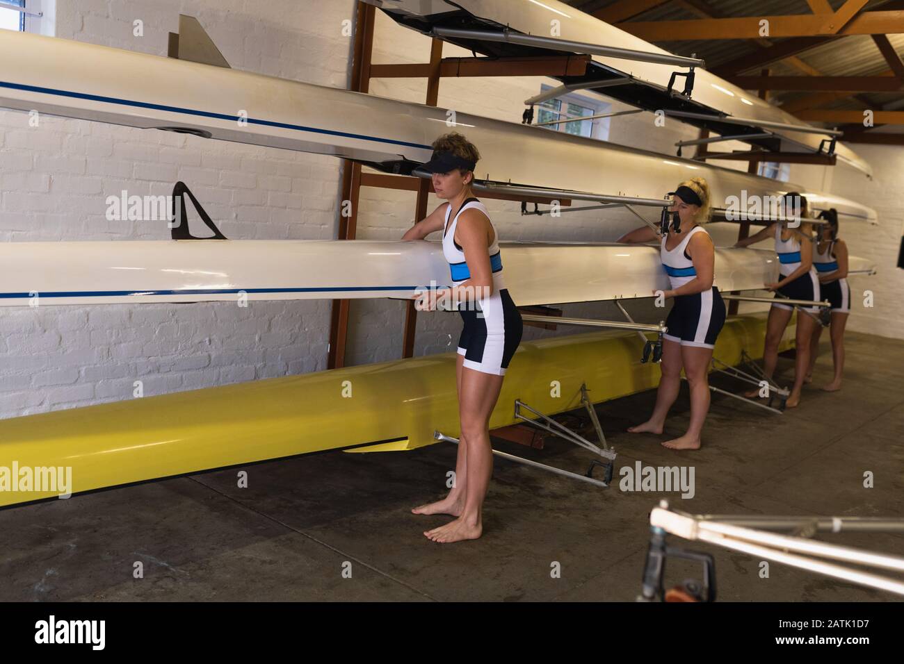 Female rowing team training on a river Stock Photo - Alamy