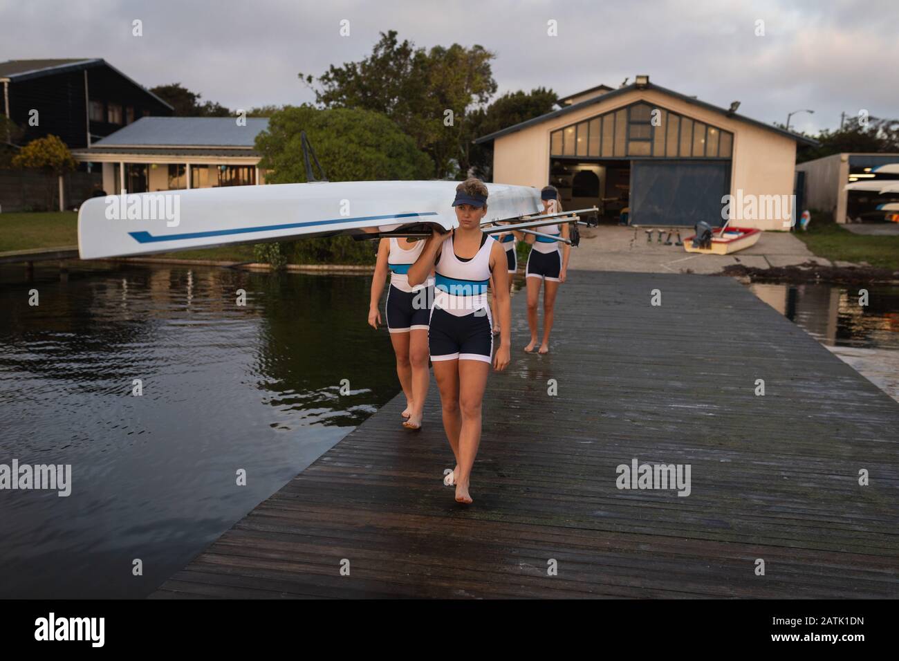 Female rowing team training on a river Stock Photo - Alamy