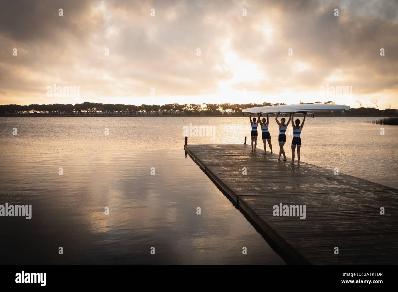 Female rowing team training on a river Stock Photo - Alamy