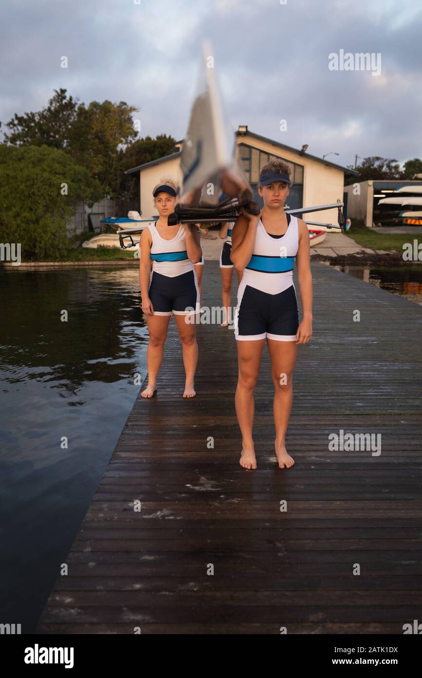Female rowing team training on a river Stock Photo - Alamy