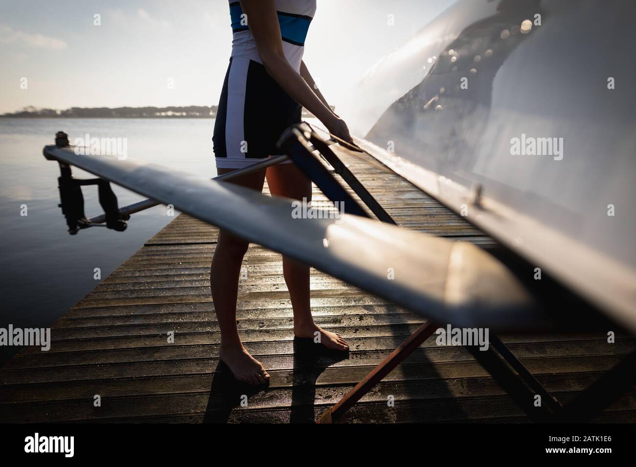 Female rowing team training on a river at the sunset Stock Photo - Alamy