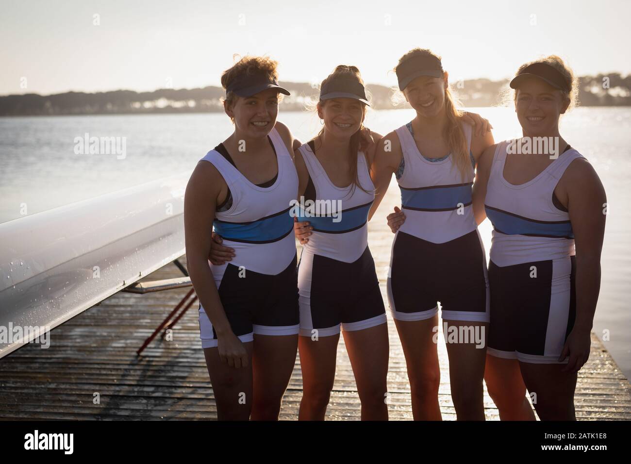Female rowing team posing on a bridge at the sunset Stock Photo - Alamy