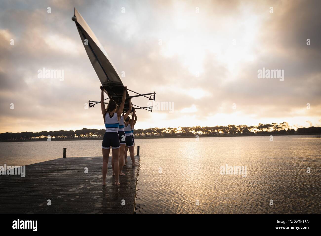 Female rowing team training on a river Stock Photo - Alamy