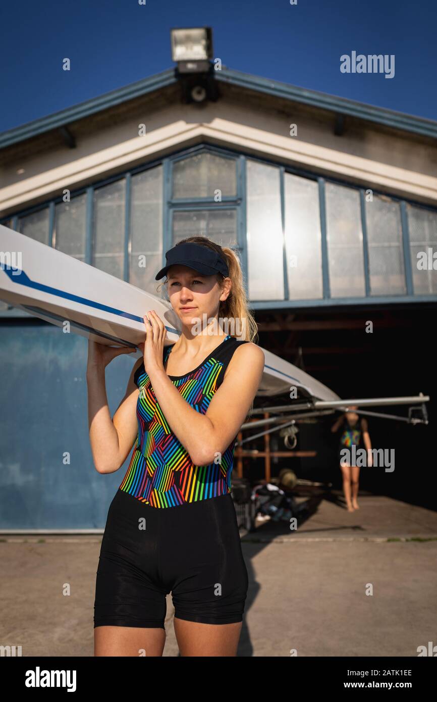 Female rowing team training on a river Stock Photo - Alamy