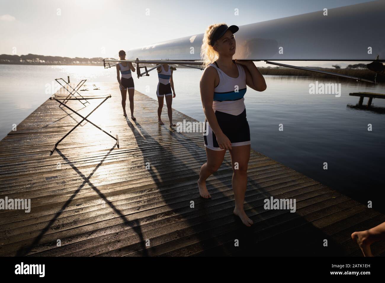Female rowing team training on a river at the sunset Stock Photo - Alamy