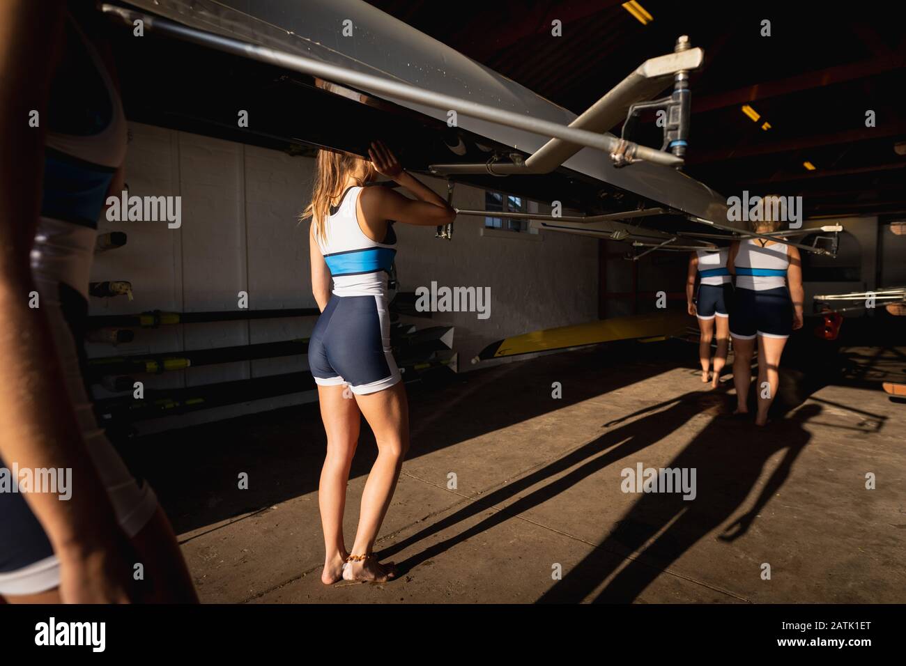 Female rowing team training on a river Stock Photo - Alamy