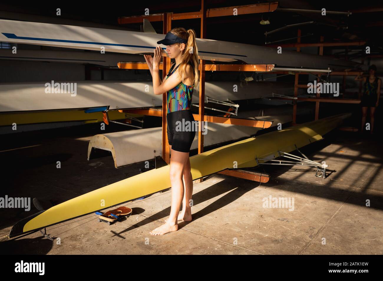 Female rowing team training on a river Stock Photo - Alamy