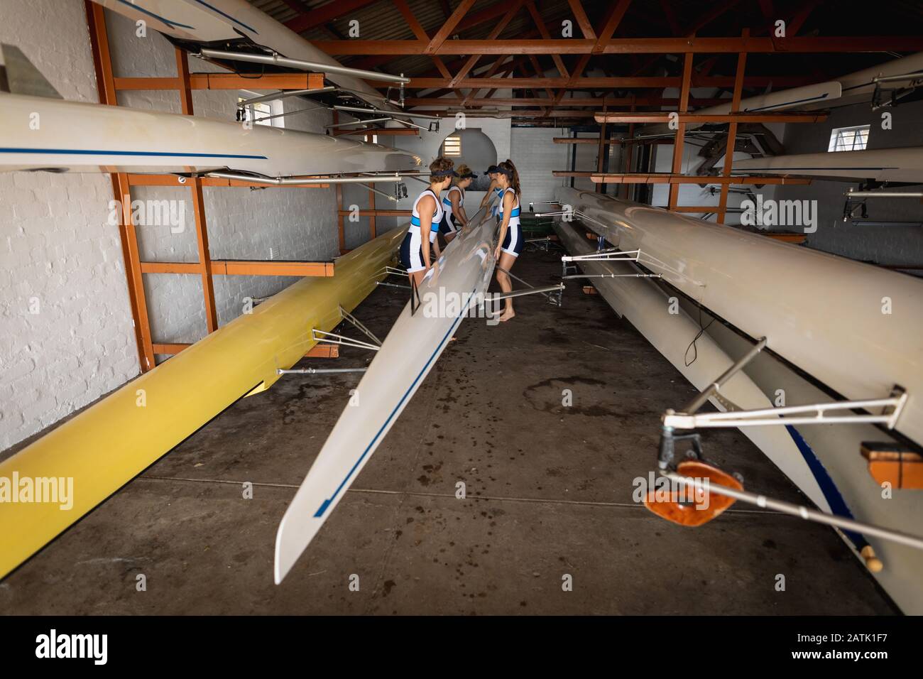 Female rowing team training on a river Stock Photo - Alamy
