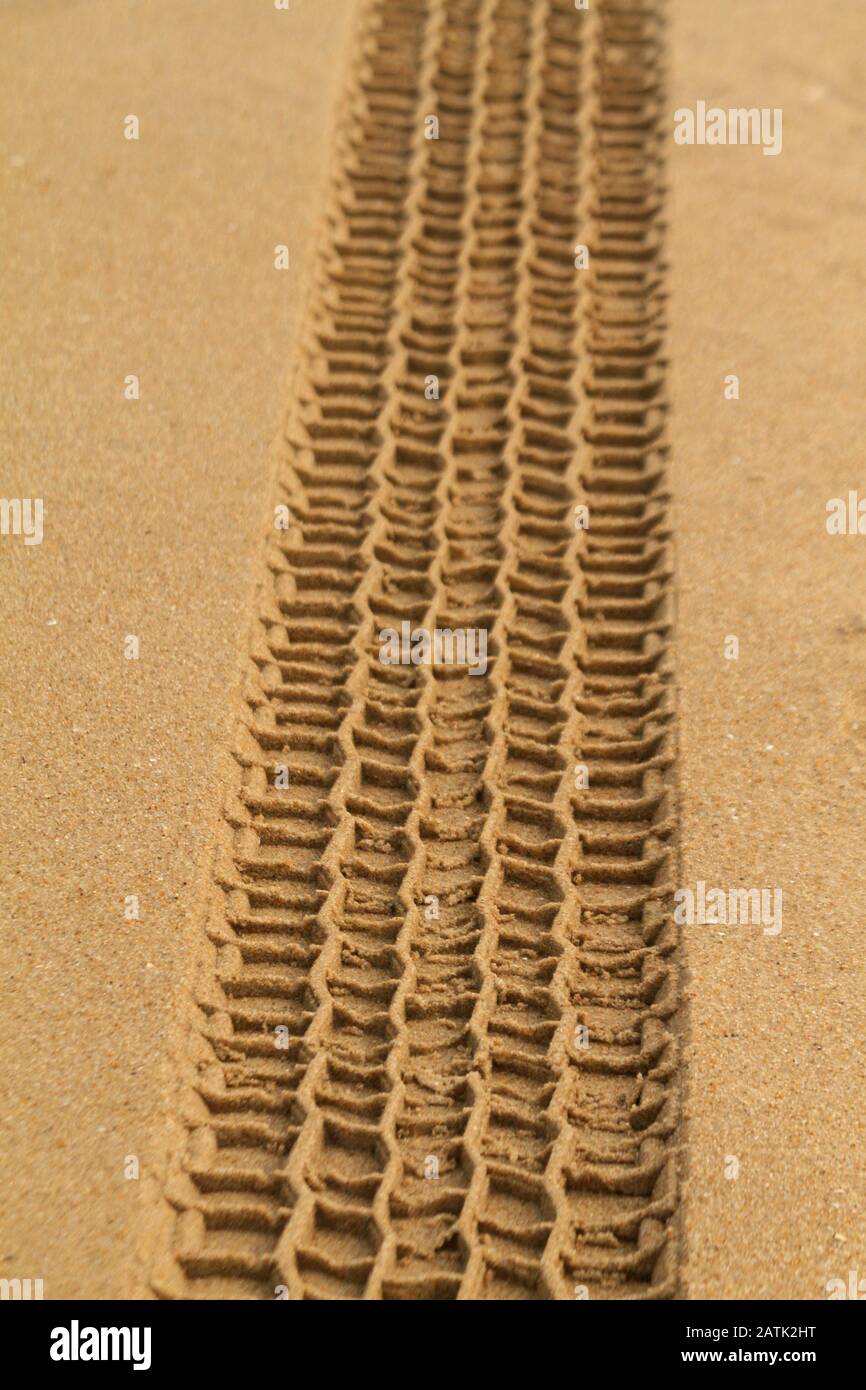 Car wheel print on sand Stock Photo - Alamy