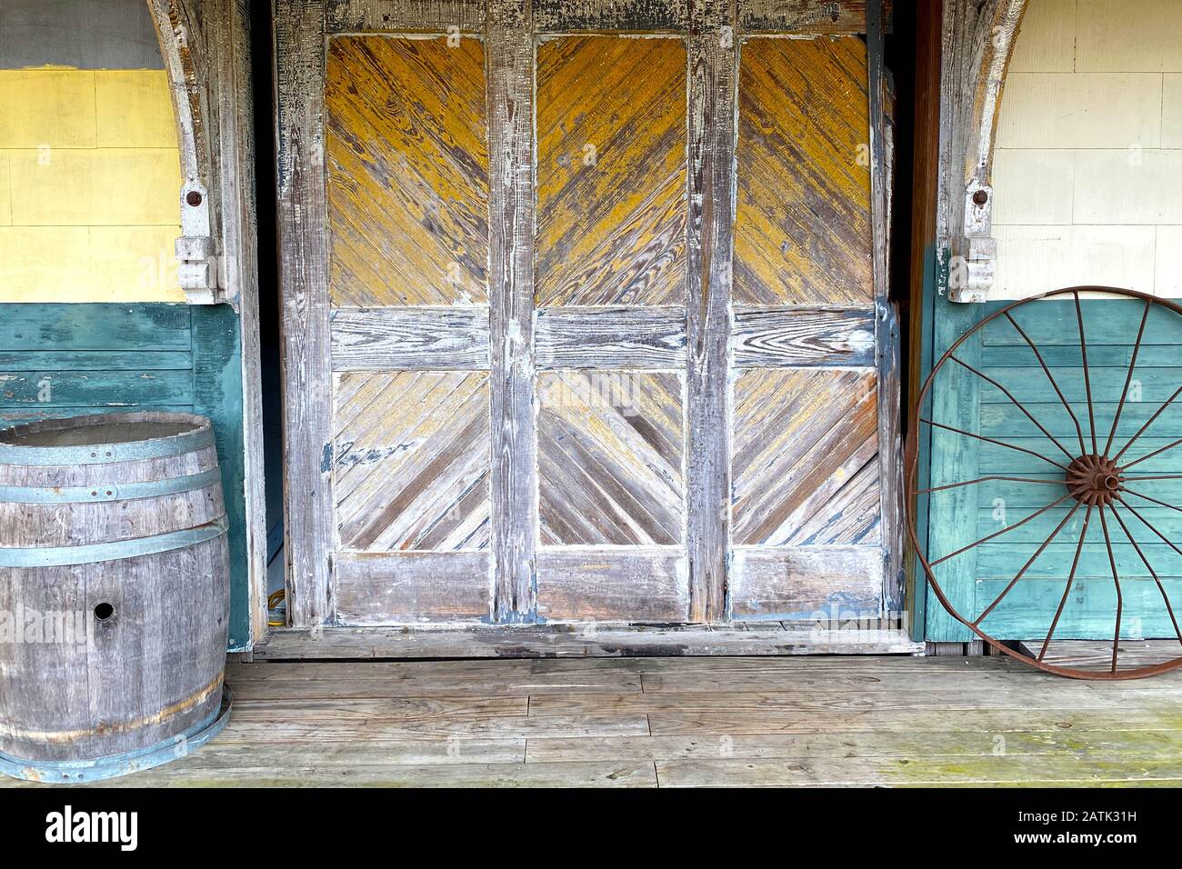 a yellow green farm barn loading platform Stock Photo - Alamy
