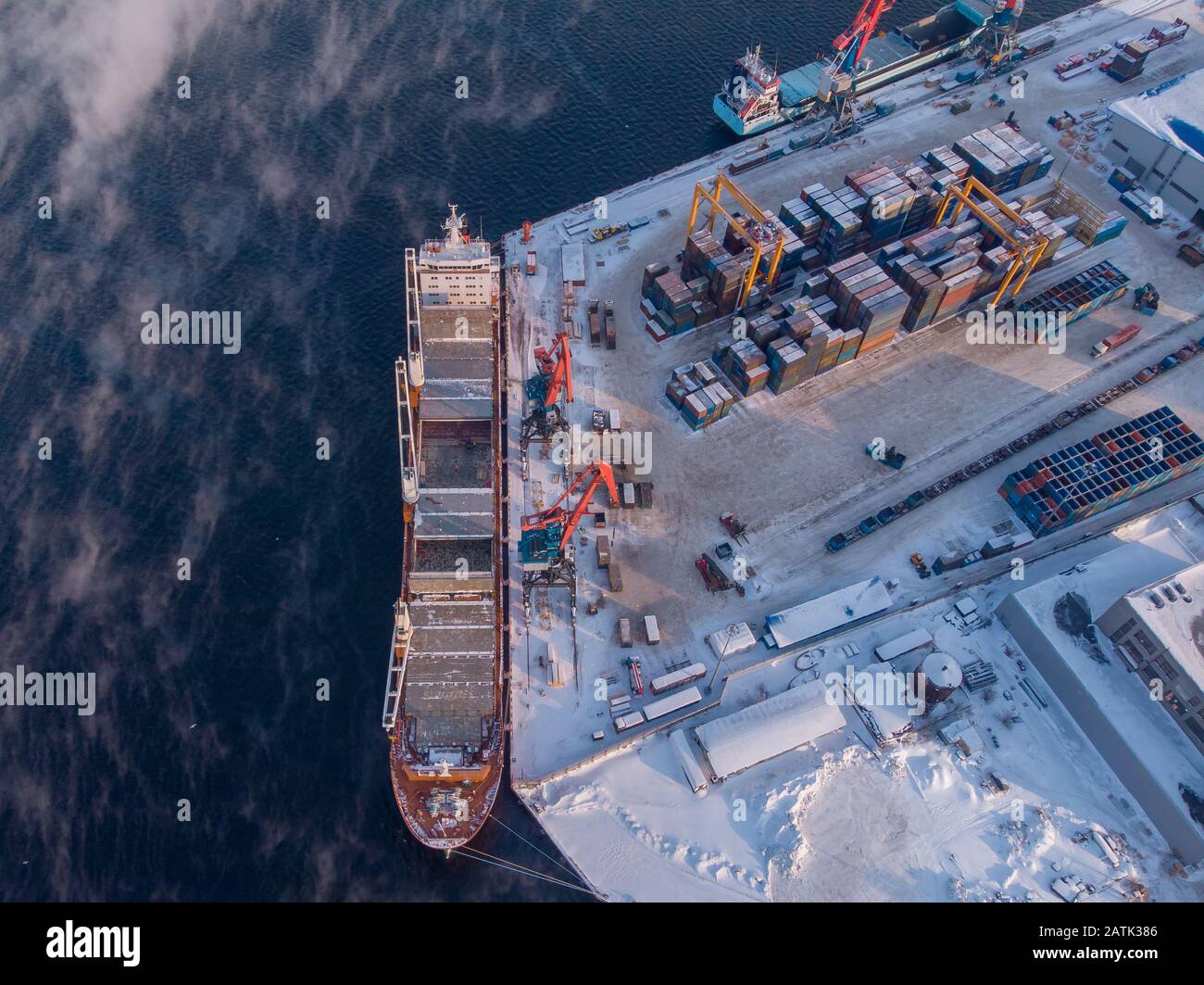 Container cargo ship loading North Arctic port. Concept freight ...