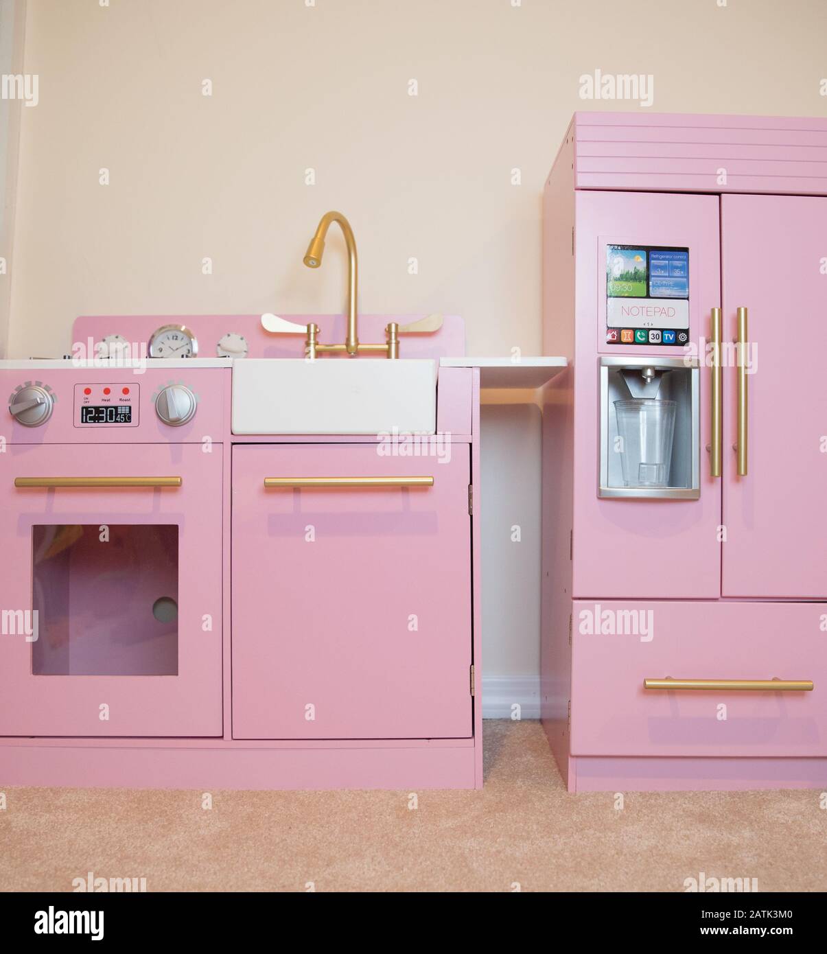 Vintage Pink toy kitchen for kids - Image Stock Photo - Alamy