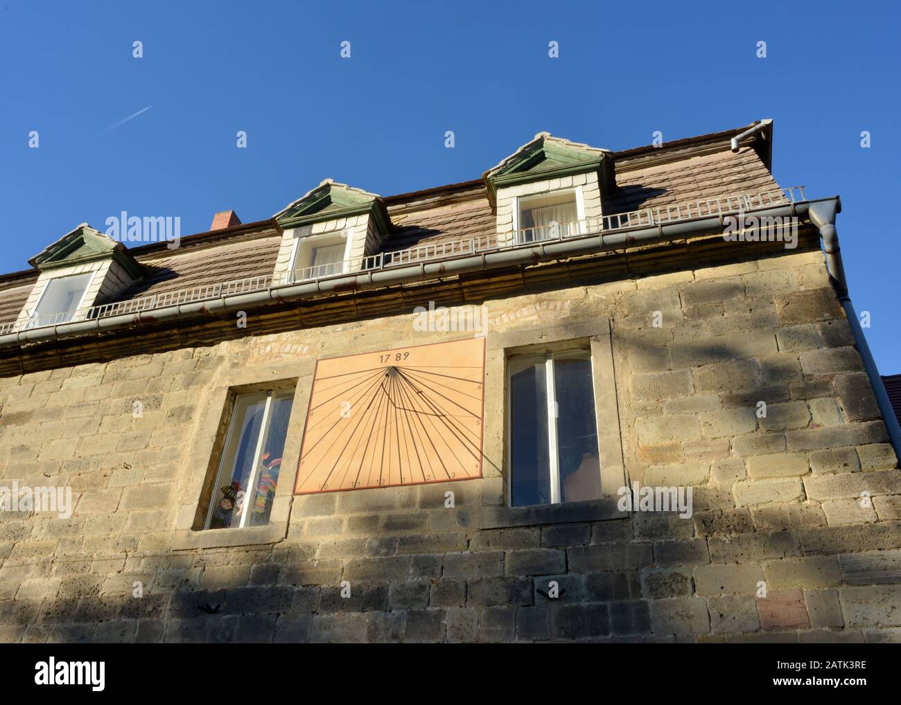 historical sun clock on a building facade outdoors Stock Photo - Alamy