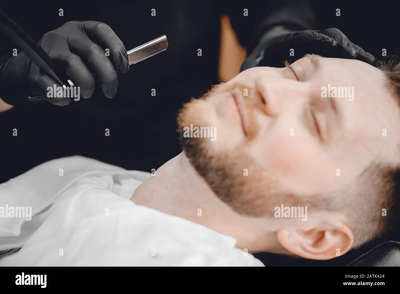 Barbershop. Hairdressers barber hair and beard with razor in salon ...