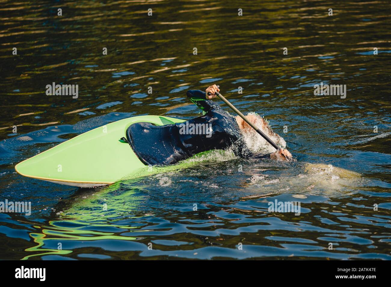 Extreme trick on kayak in mountain river eskimo coup Stock Photo - Alamy