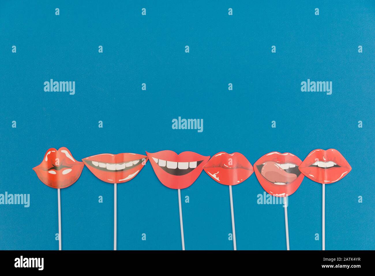 flatlay overhead top paper photo booth props red lips on blue ...