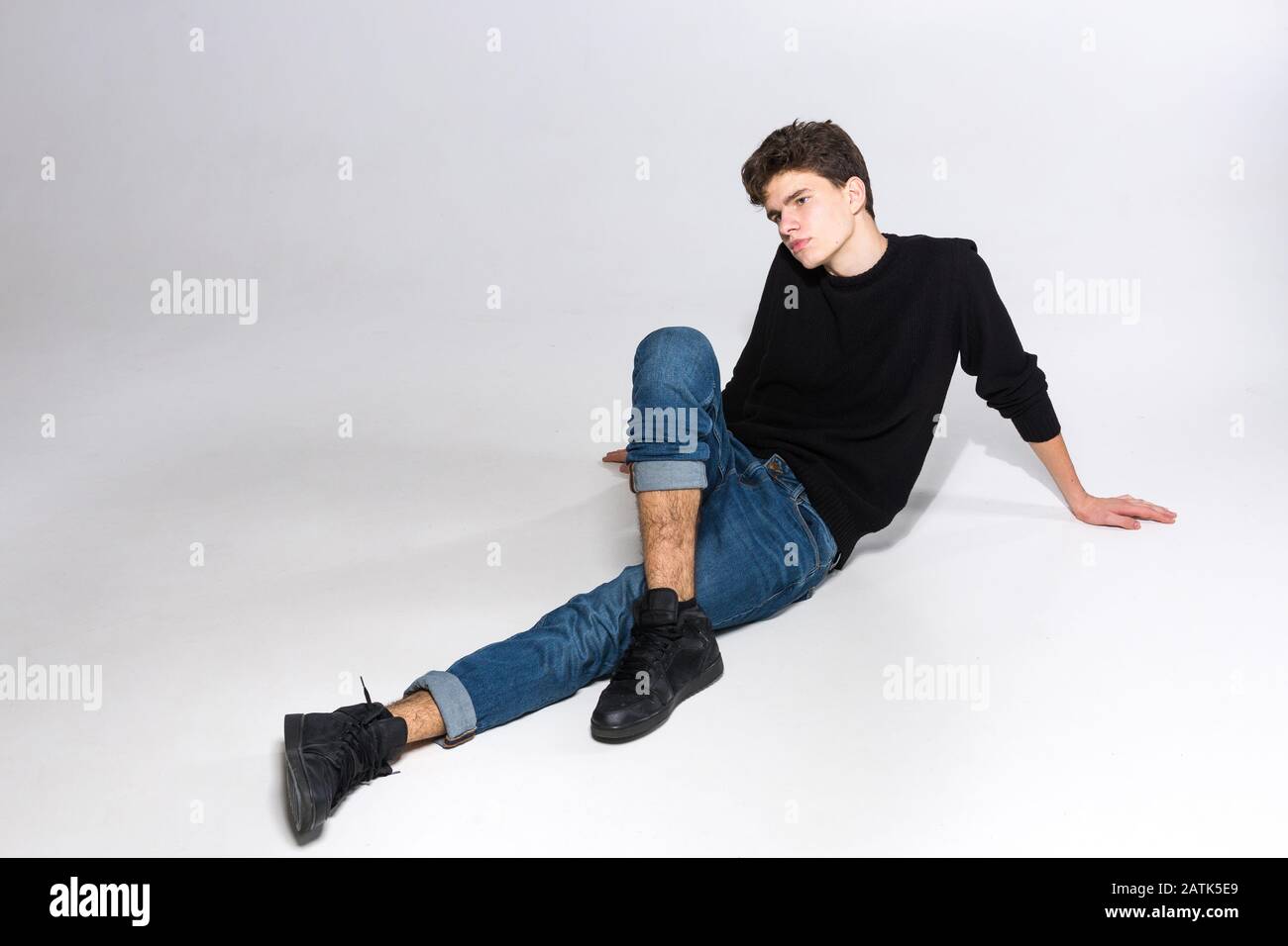 Stylish handsome man posing sitting on floor. Handsome Guy. cool ...