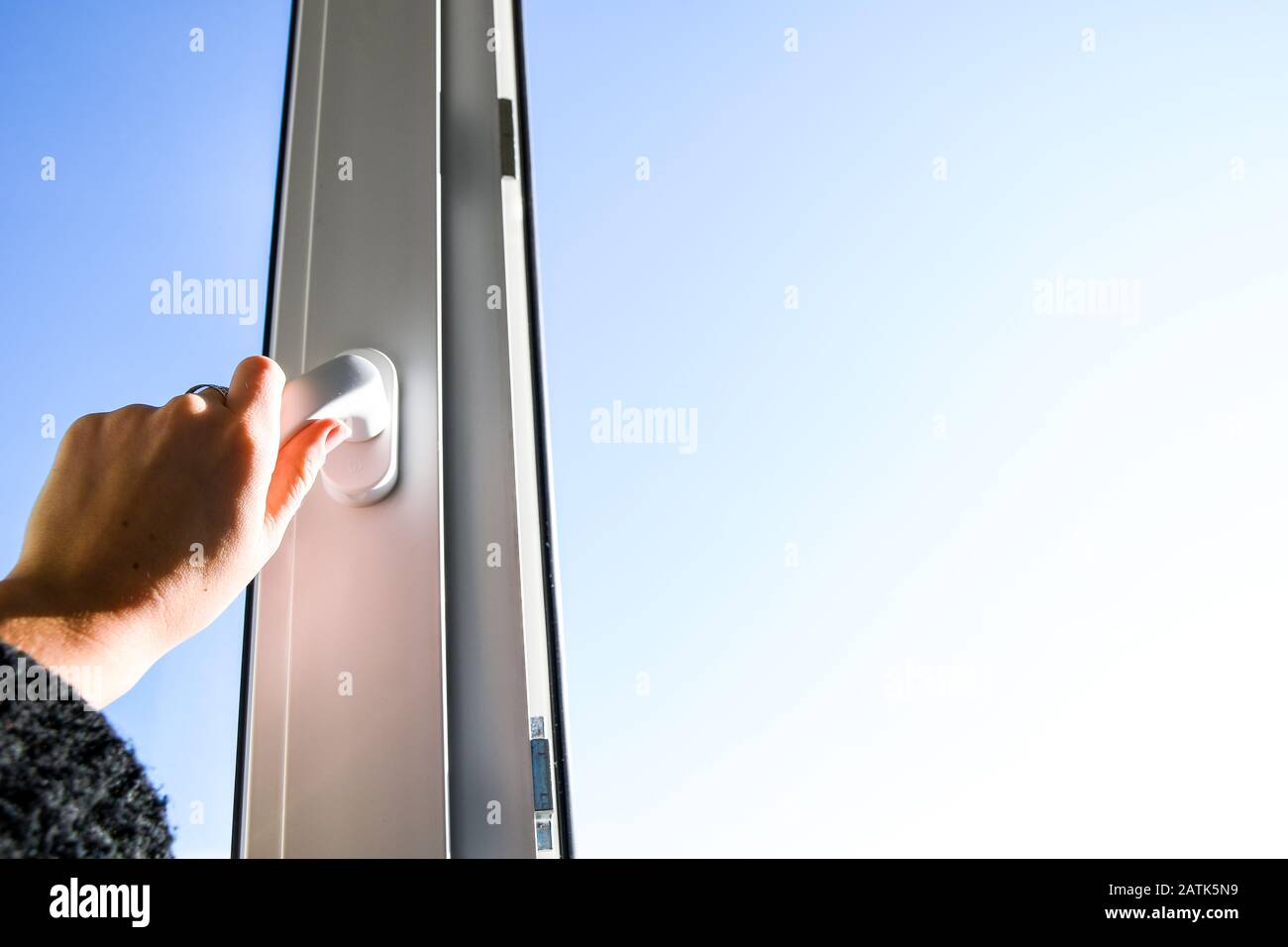 hand opening plastic vinyl window Stock Photo - Alamy
