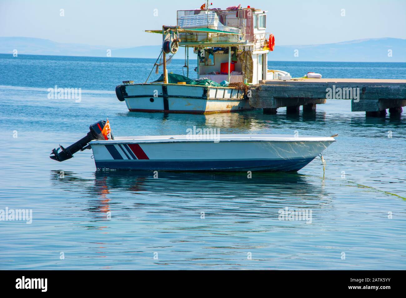 Small traditional fishing boat in the sea Stock Photo - Alamy