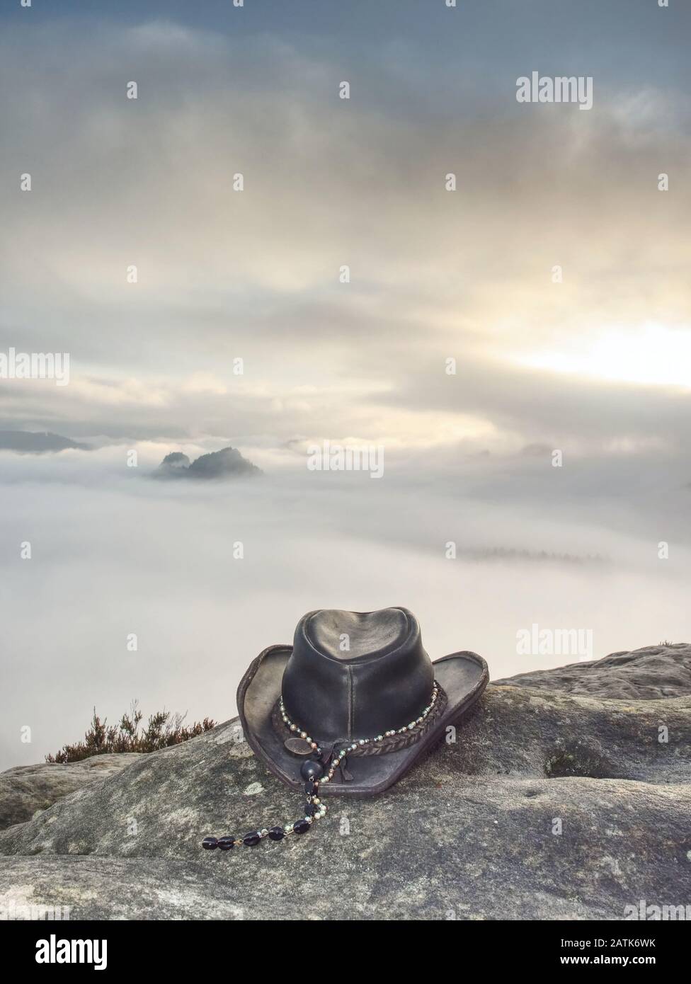 Cowboy hat ready on the rock. Leather cowboy accessories Stock Photo ...
