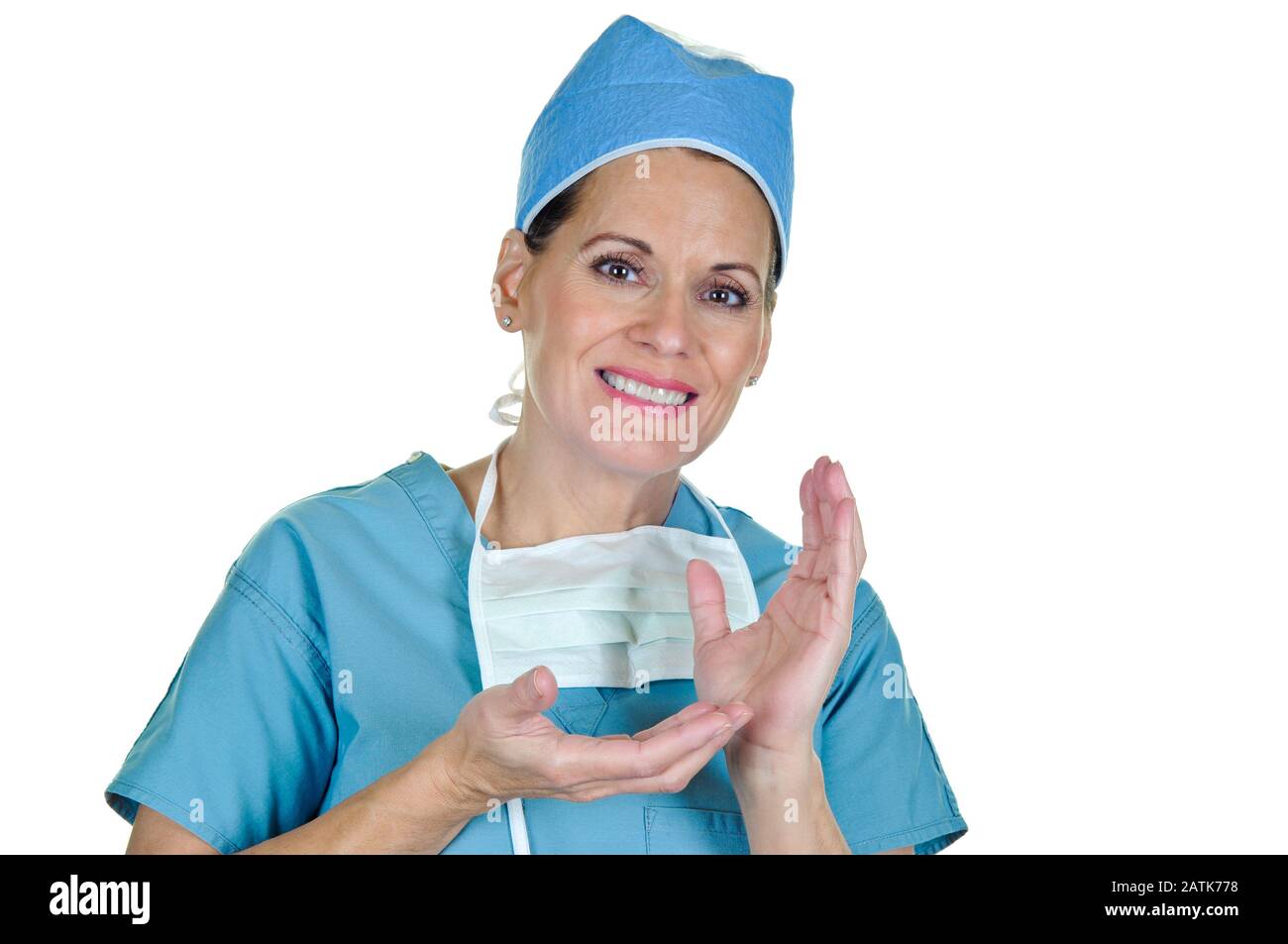 An Attractive Female Surgeon wearing surgical mask and hat Stock Photo ...