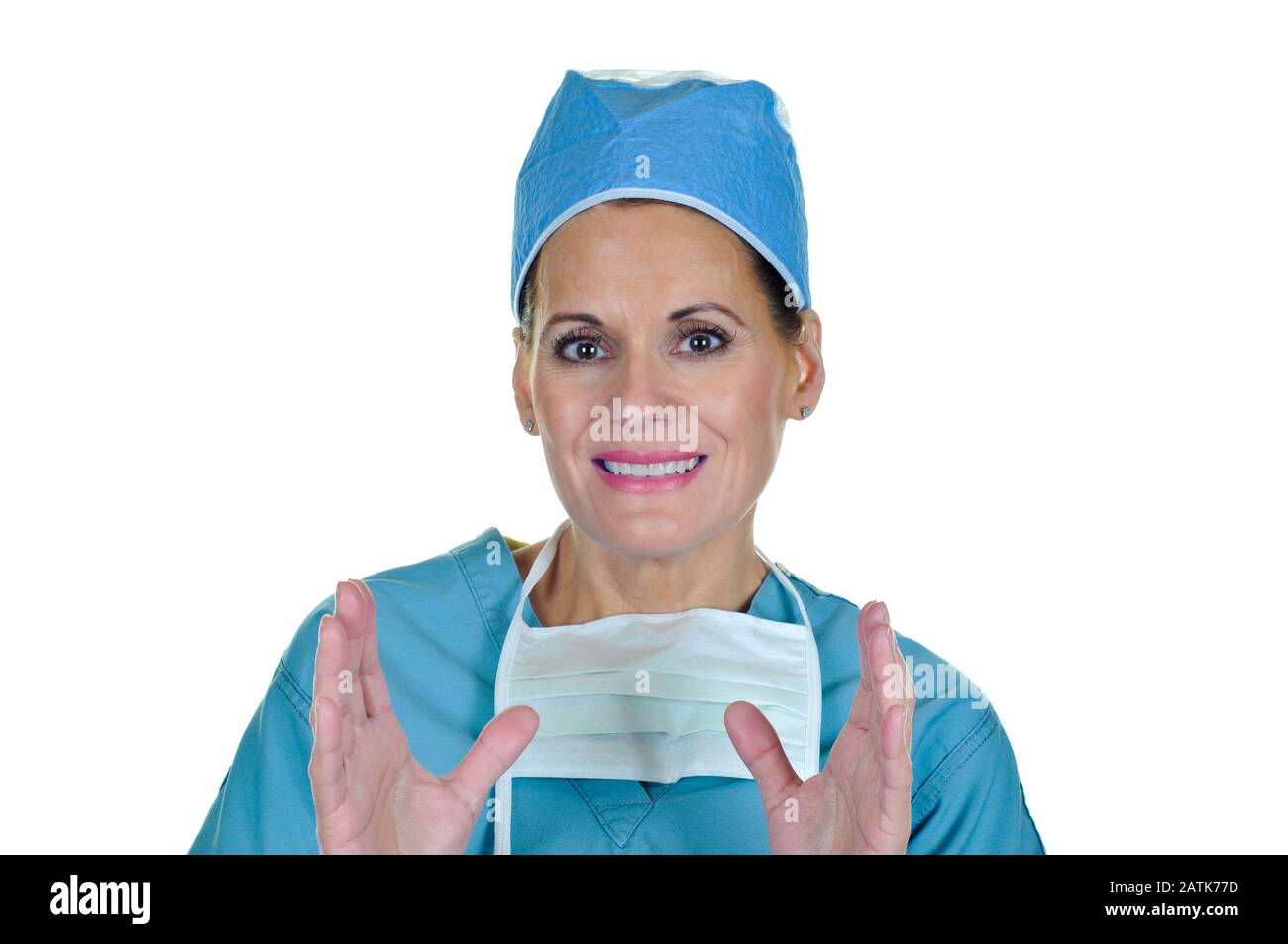An Attractive Female Surgeon wearing surgical mask and hat Stock Photo ...
