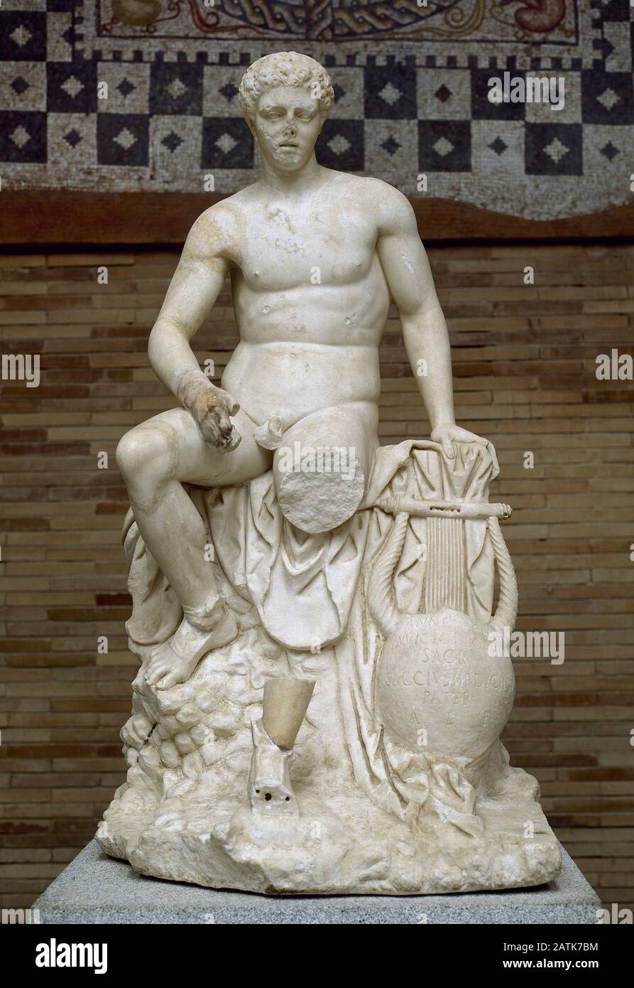Statue of God Mercury resting on a rock with the lyre of turtle shell ...