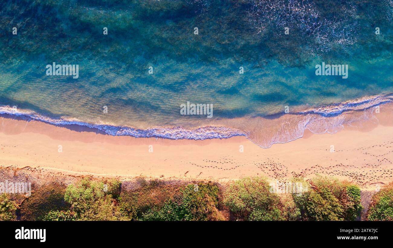 Aerial view down onto Laie Beach Park (Pounders) with calm turquoise ...