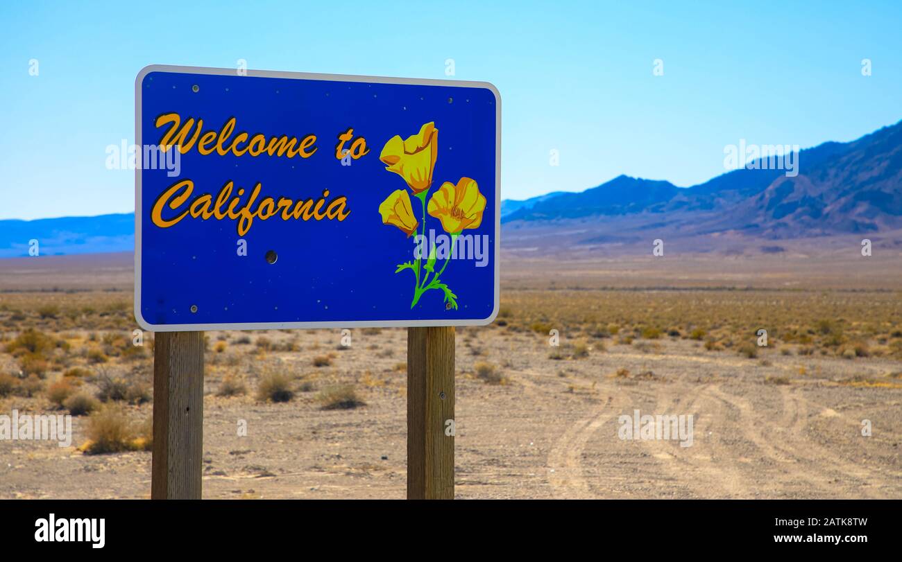 Welcome to California road sign. Beautiful desert landscape with ...