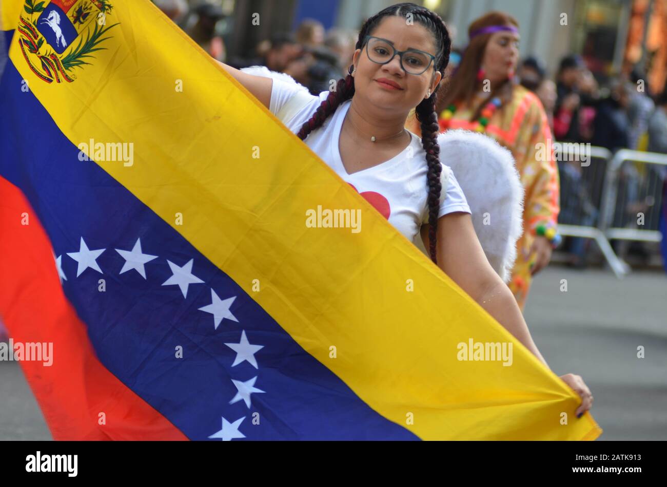 A participant is seen holding venezuelan flag during the annual ...