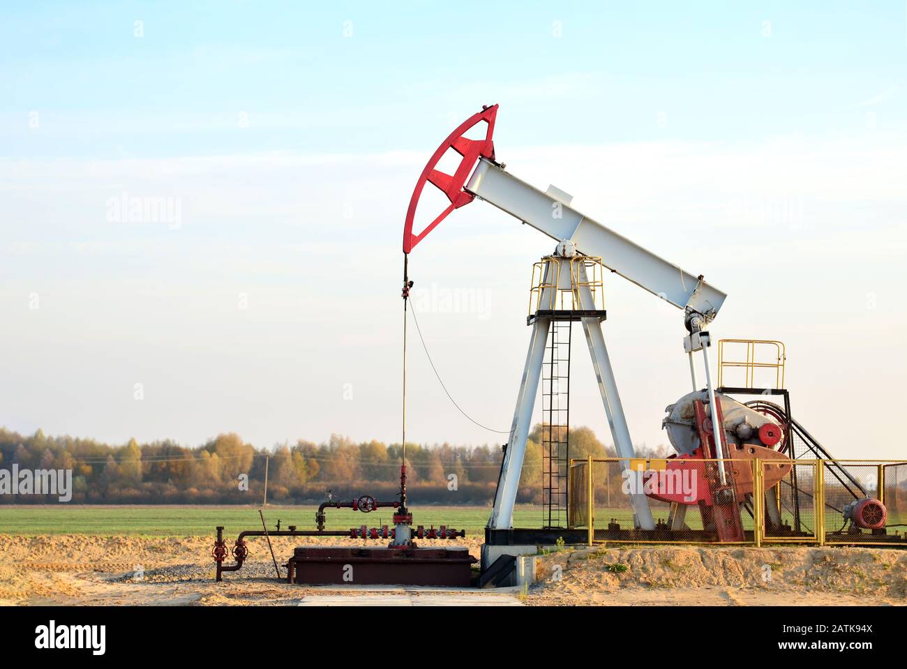 Oil drilling derricks at desert oilfield for fossil fuels output and ...