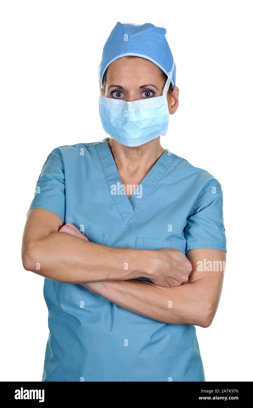 An Attractive Female Surgeon wearing surgical mask and hat Stock Photo ...