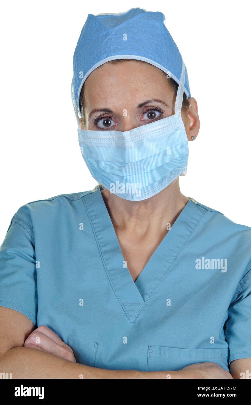An Attractive Female Surgeon wearing surgical mask and hat Stock Photo ...