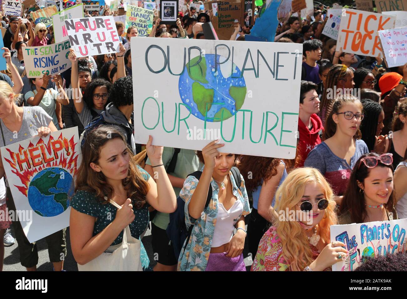 School Students holding different signs during the environmental march ...