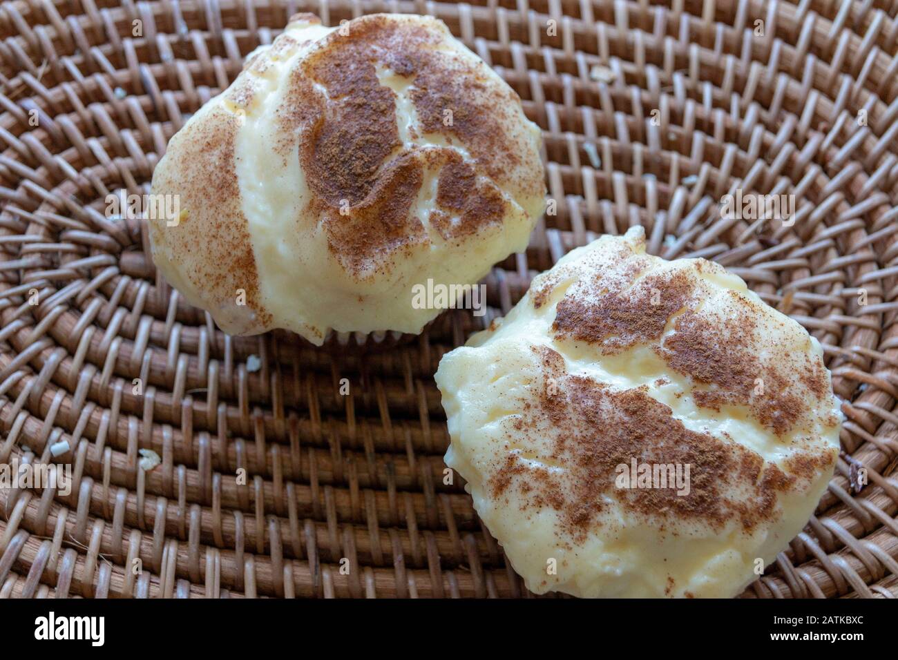 a close up view of small milk tart ckes Stock Photo - Alamy