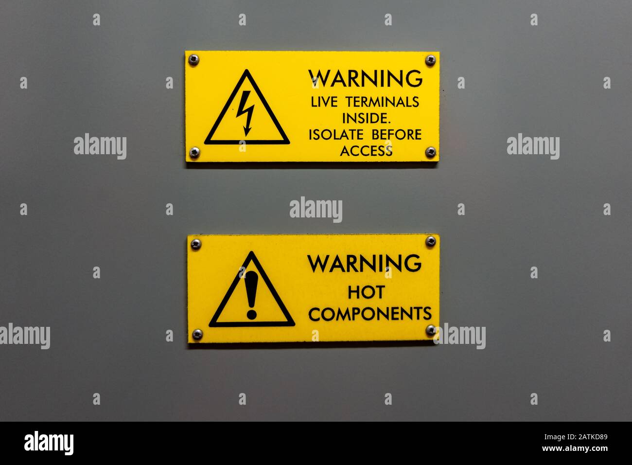 Dual live terminals inside and hot components yellow warning sign Stock ...