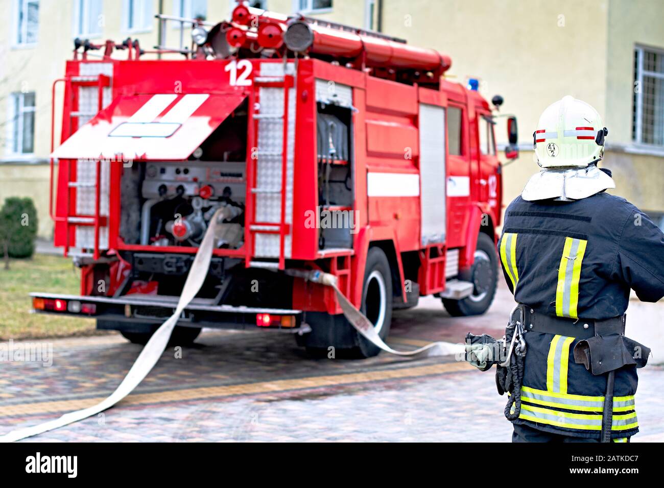Firefighters walking to the fire truck after responding an emergency ...
