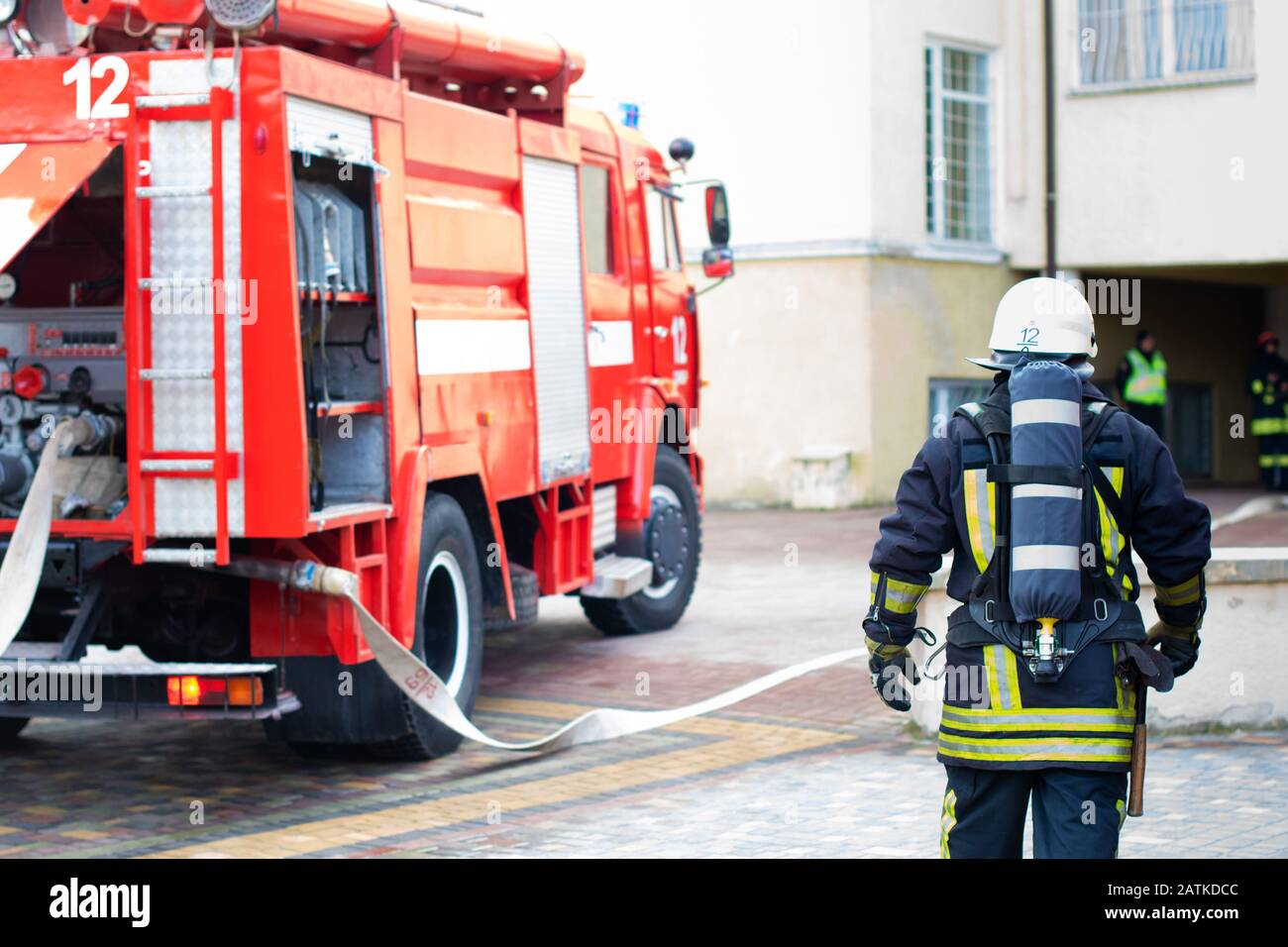 Firefighters walking to the fire truck after responding an emergency ...