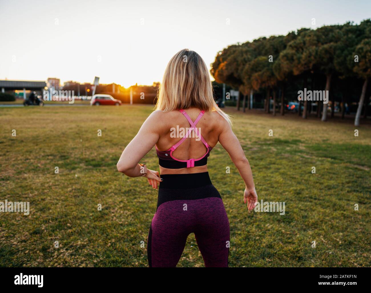 Sport training in city park. Beautiful runner woman posing Stock Photo ...