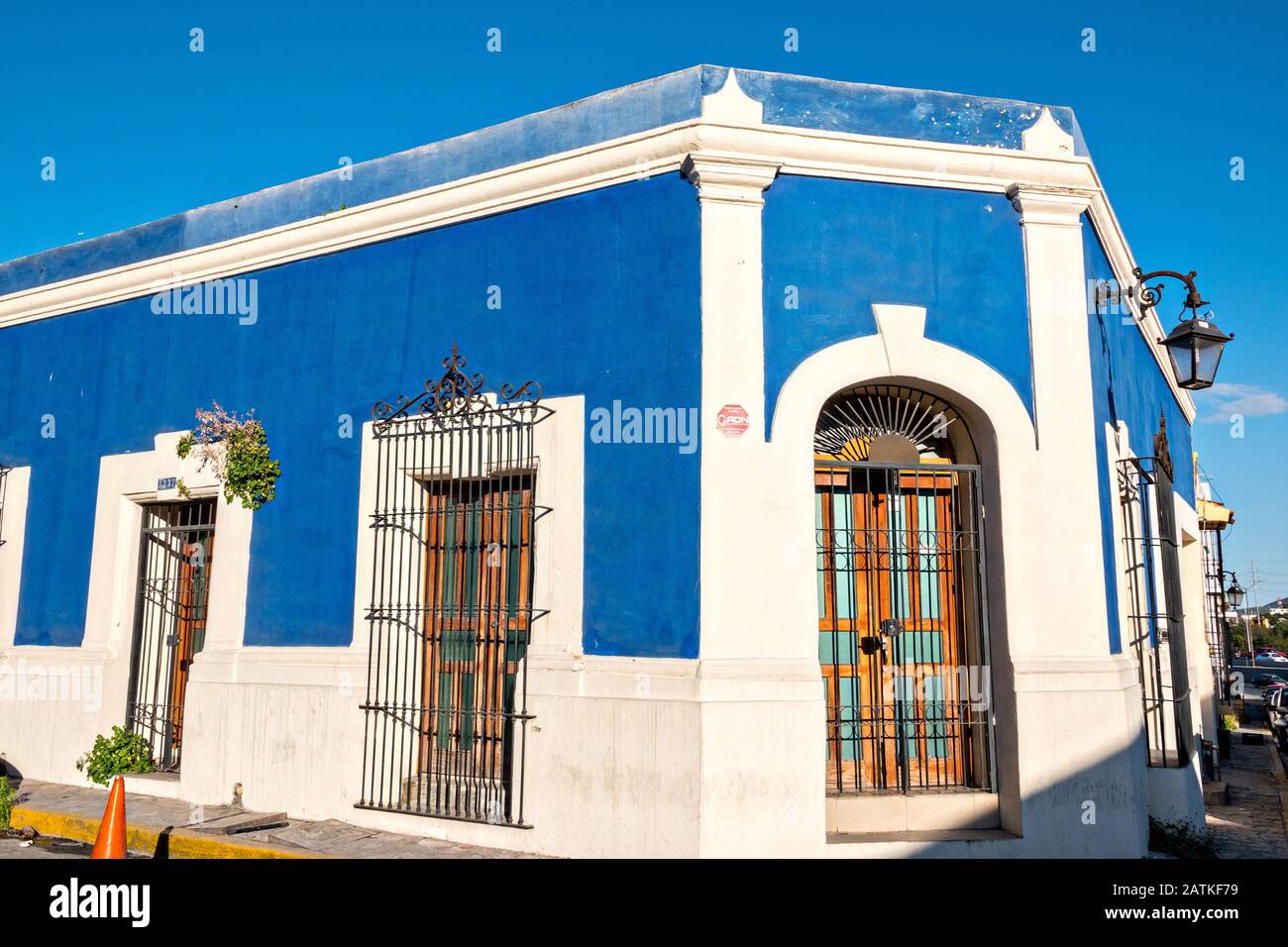 A brightly painted Spanish colonial style building in the Barrio ...