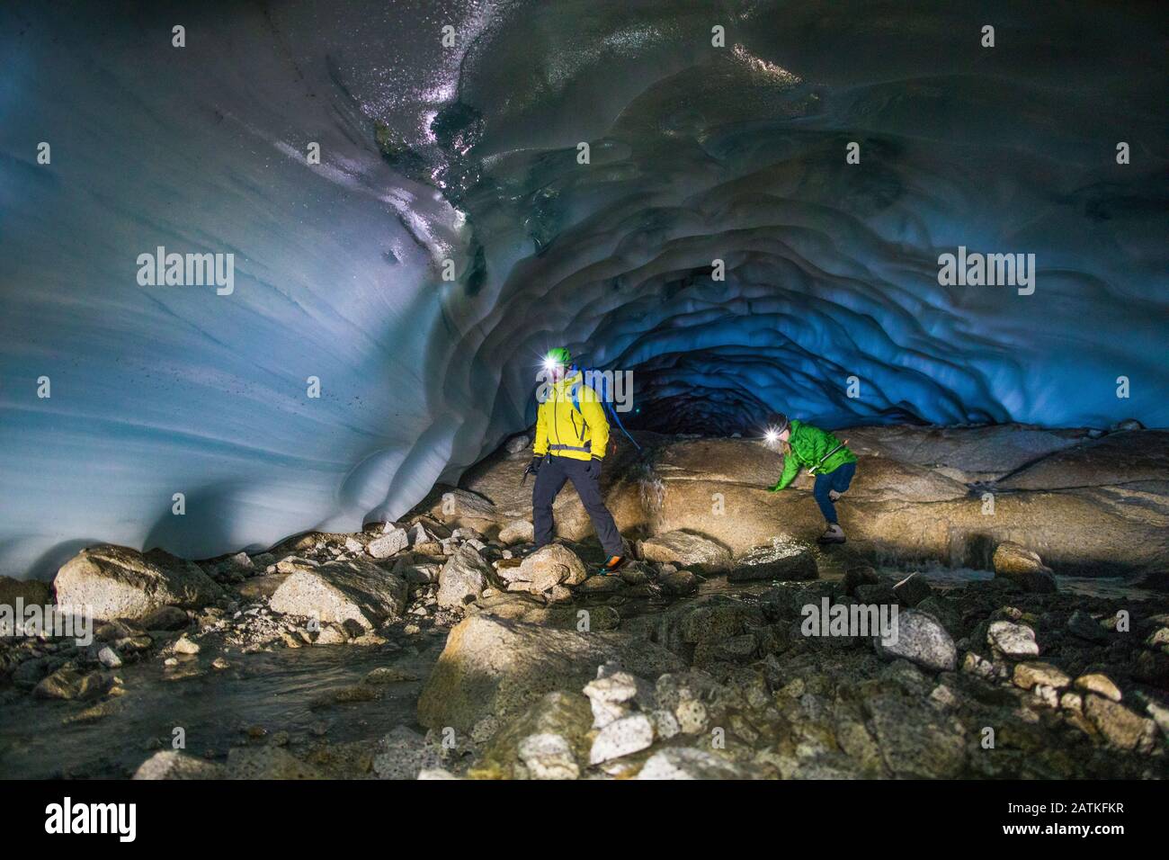 Adventurous couple exploring ice cave near Vancouver Stock Photo - Alamy