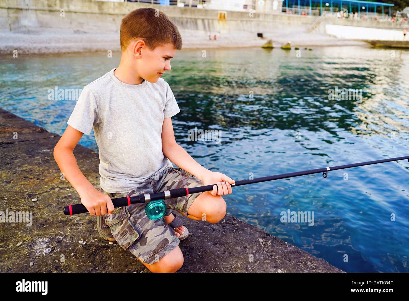 Man pulling fishing tackle hi-res stock photography and images - Alamy