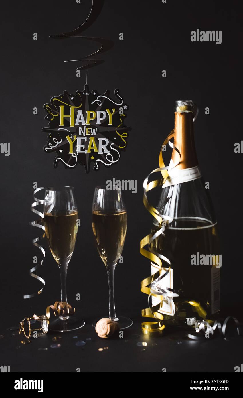 Champagne and Happy New Year sign with black background Stock Photo - Alamy