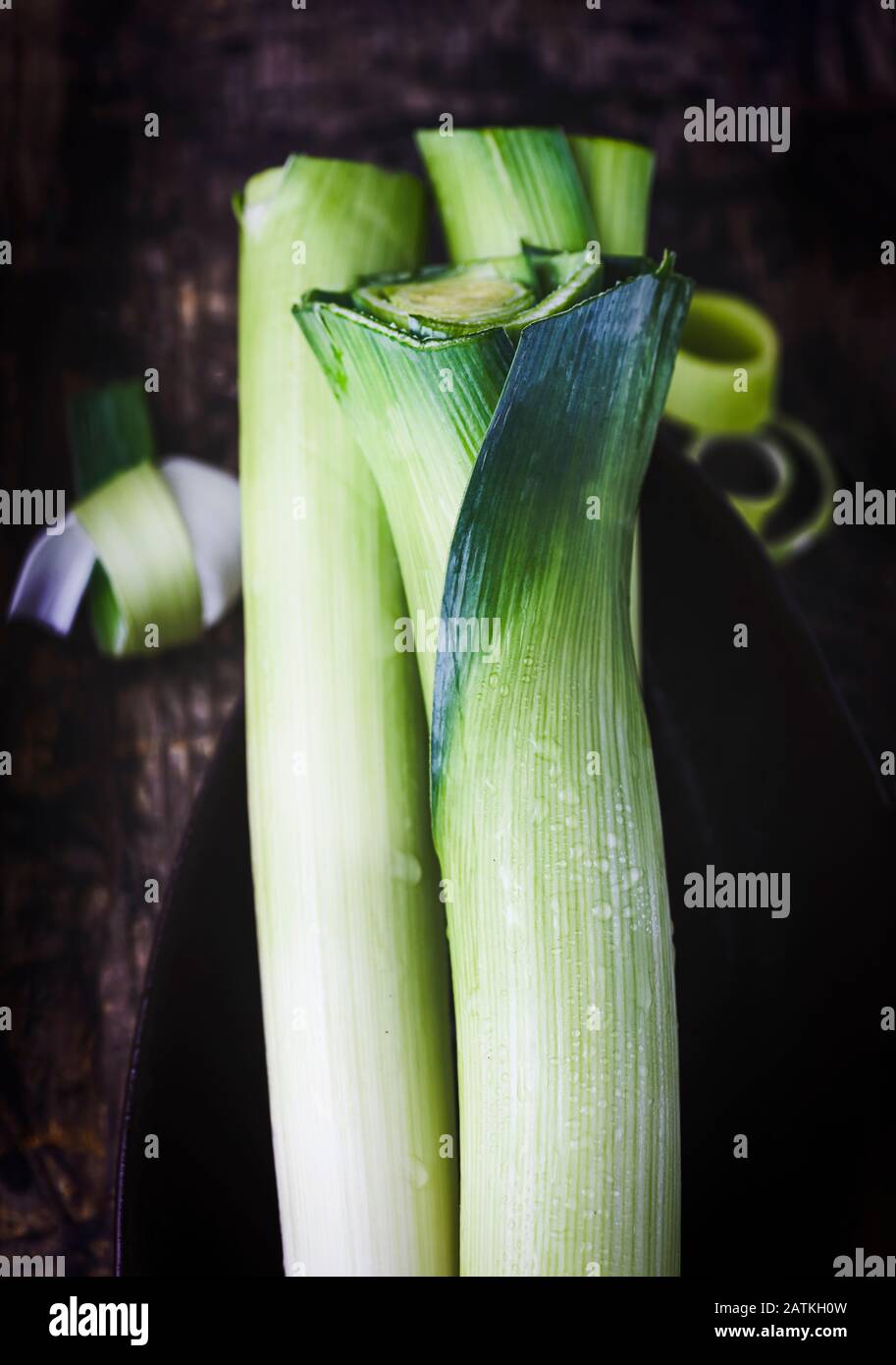 organic fresh green Leeks vertical wooden background filtered Stock ...