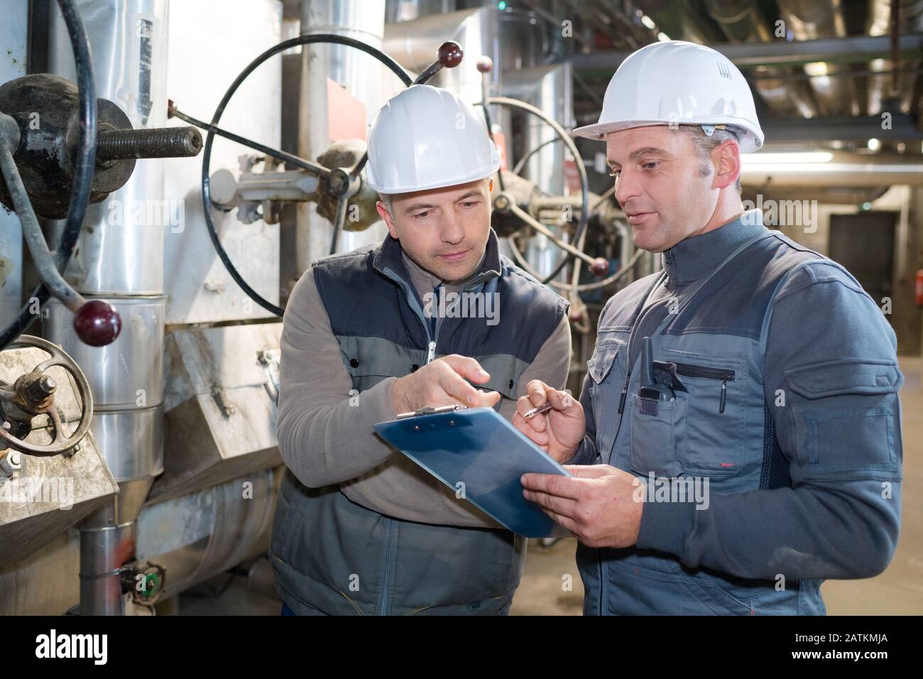 two engineers in the boiler room Stock Photo - Alamy