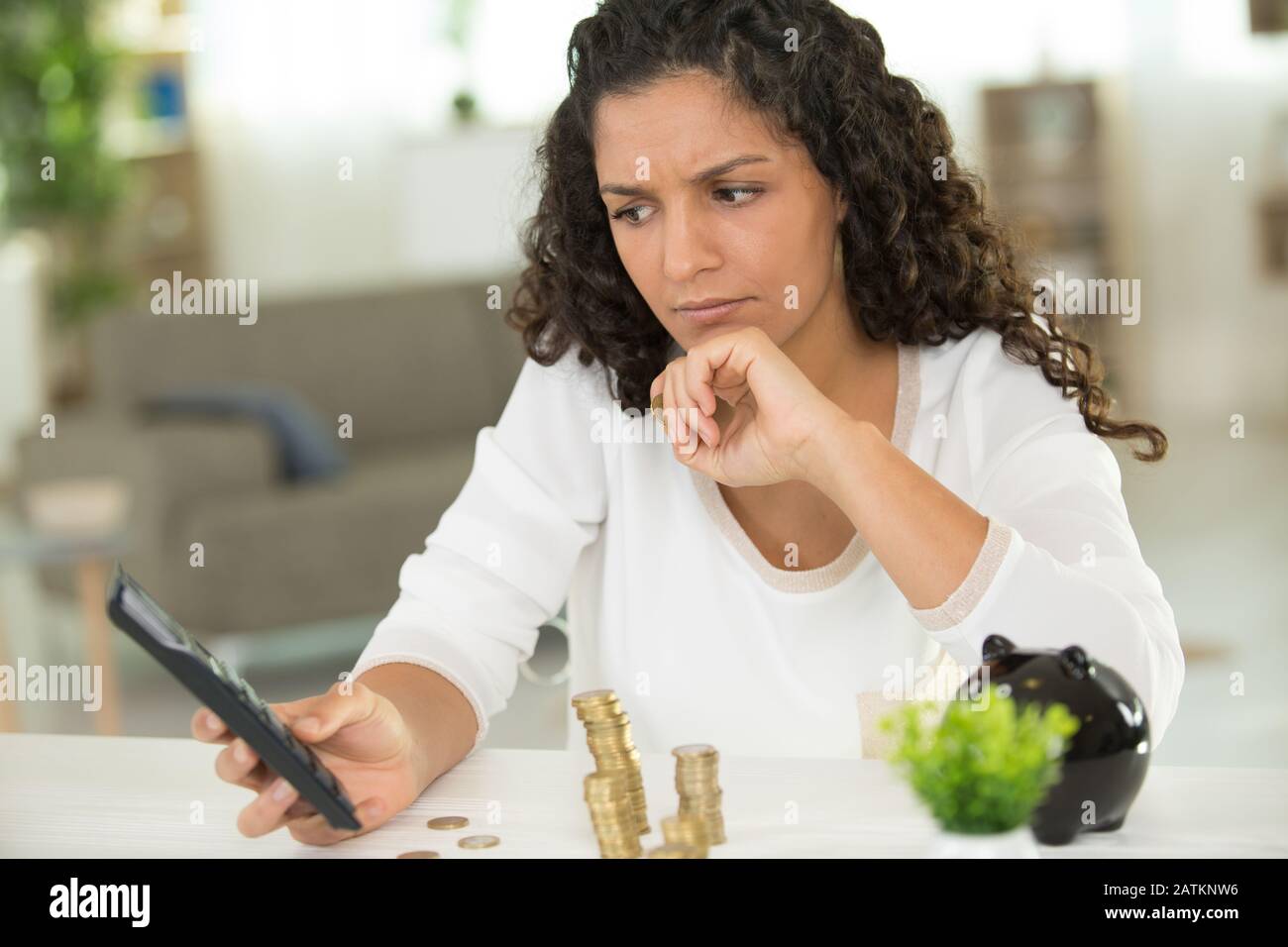 Woman counting coins hi-res stock photography and images - Alamy