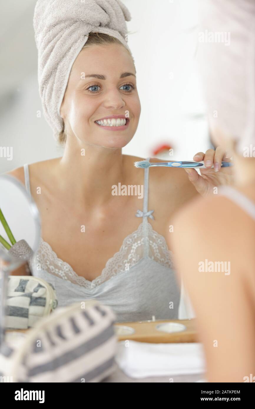 close-up of concentrated woman brushing teeth Stock Photo - Alamy