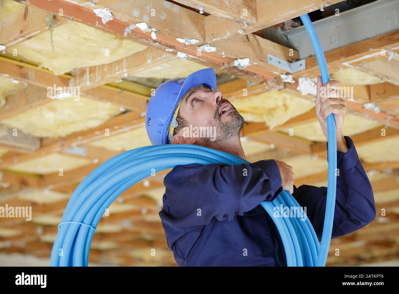 Smiling electrician working wire hi-res stock photography and images ...